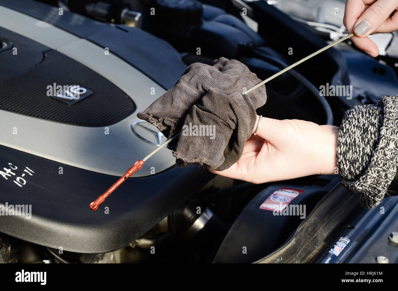 Auto mechanics check oil hi-res stock photography and images - Alamy