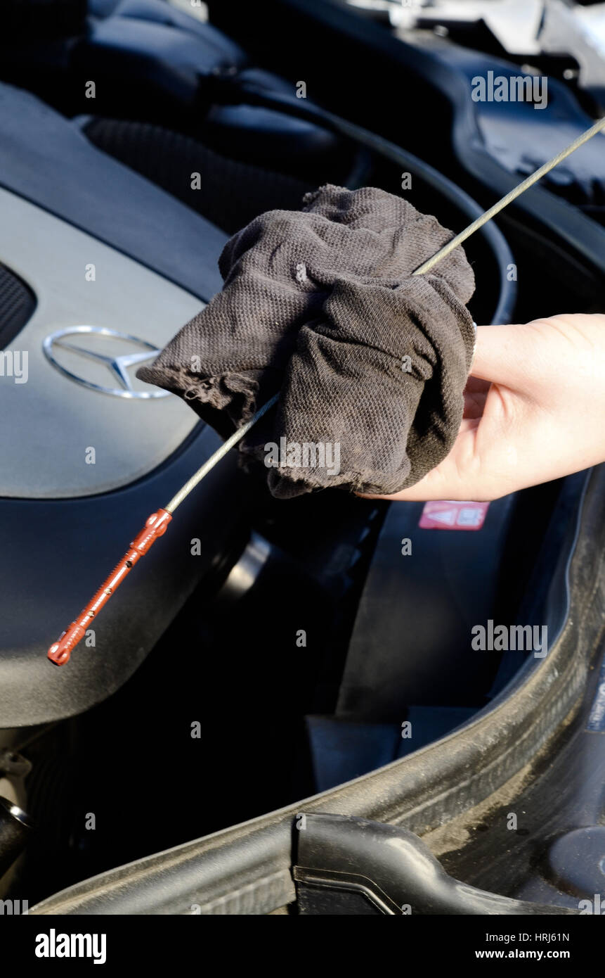 Auto mechanics check oil hi-res stock photography and images - Alamy