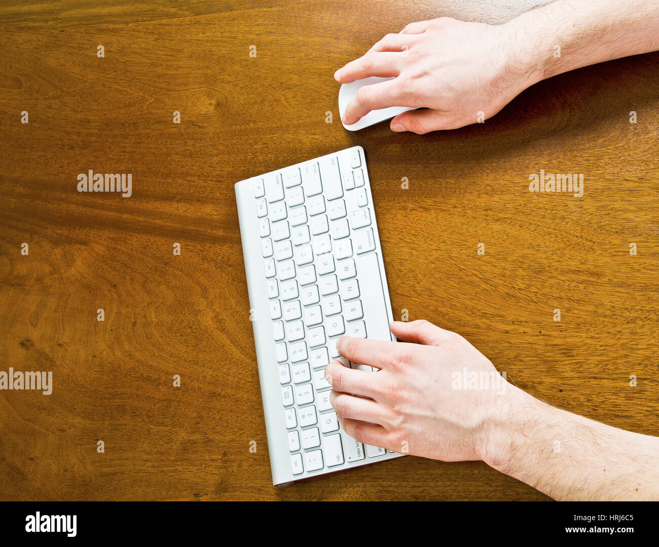 Typing on a wireless keyboard Stock Photo - Alamy