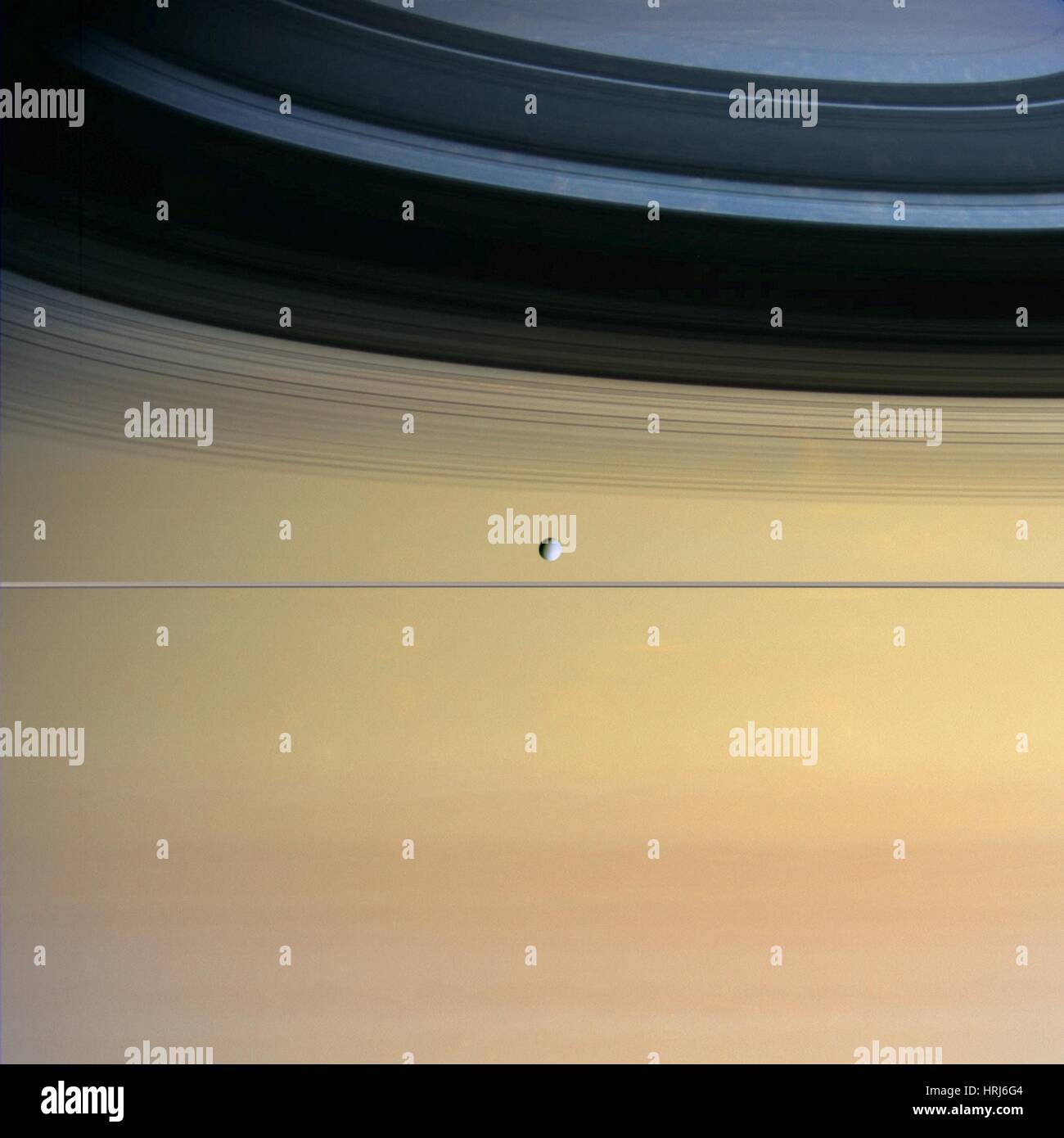 Saturn and its moon Dione Stock Photo - Alamy