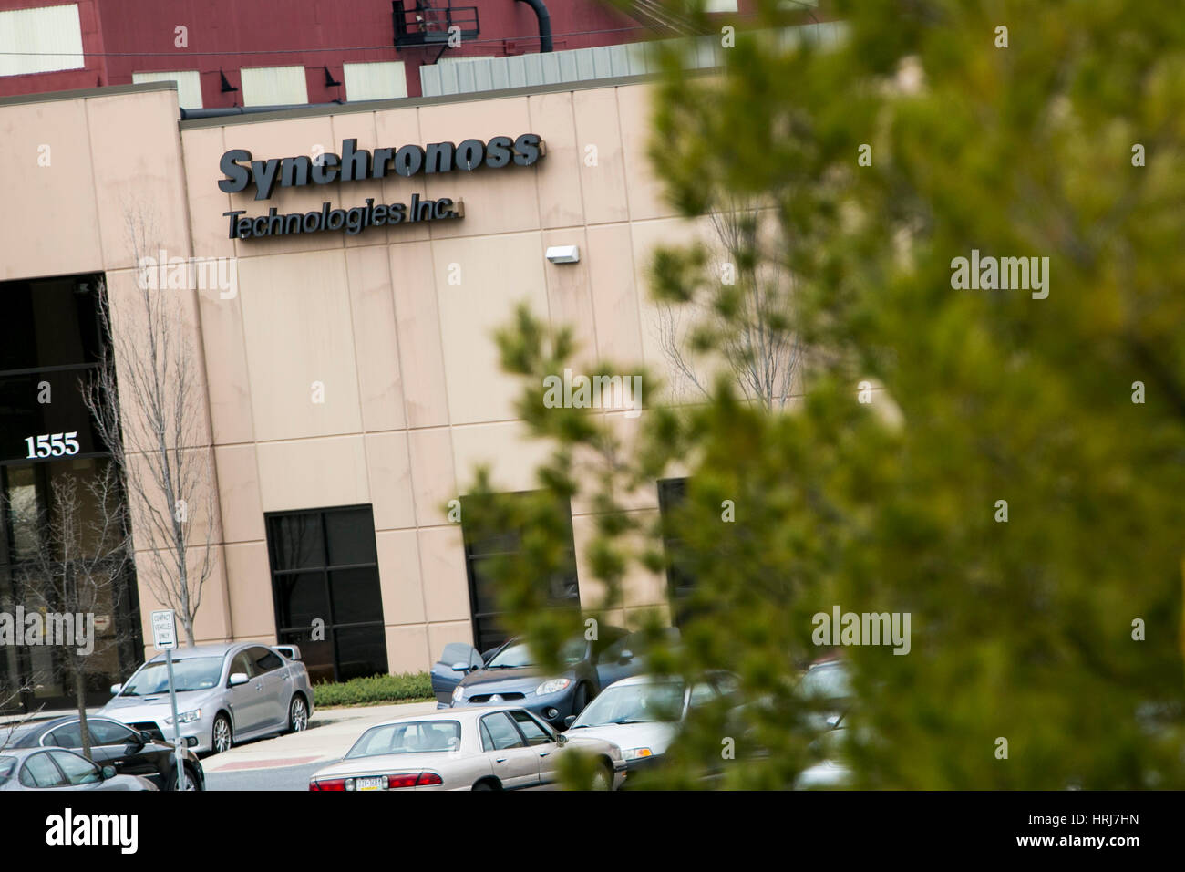A logo sign outside of a facility occupied by Synchronoss Technologies ...