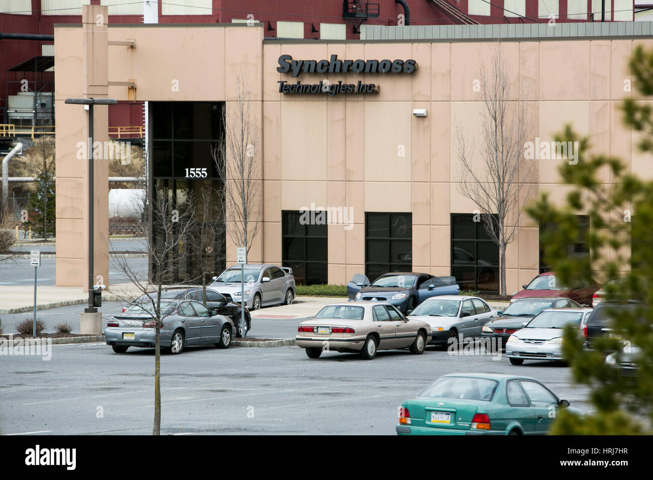 A logo sign outside of a facility occupied by Synchronoss Technologies ...