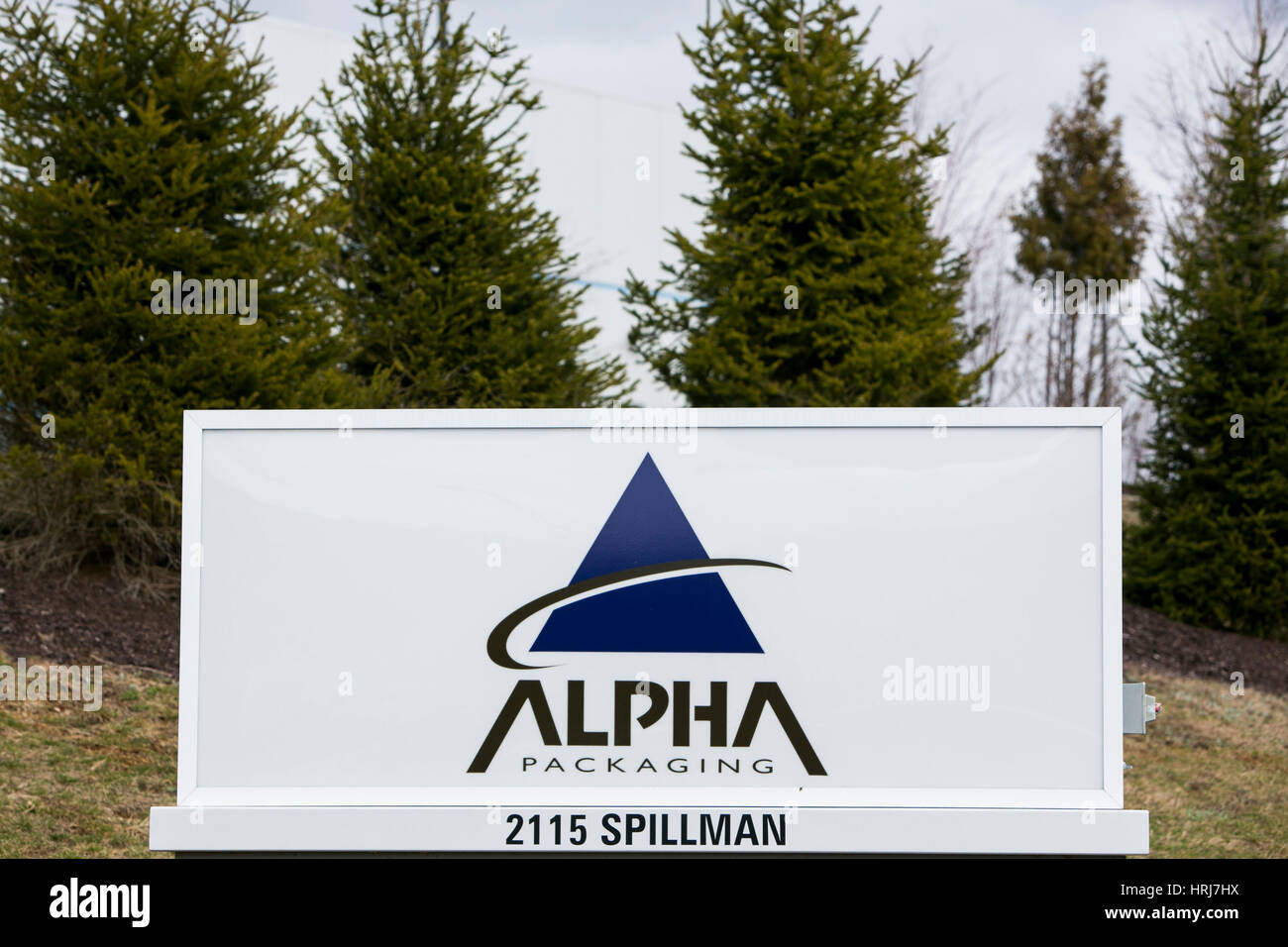 A logo sign outside of a facility occupied by Alpha Packaging in ...