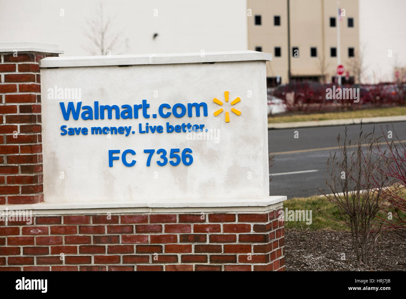 A logo sign outside of a facility occupied by Walmart.com in Bethlehem ...