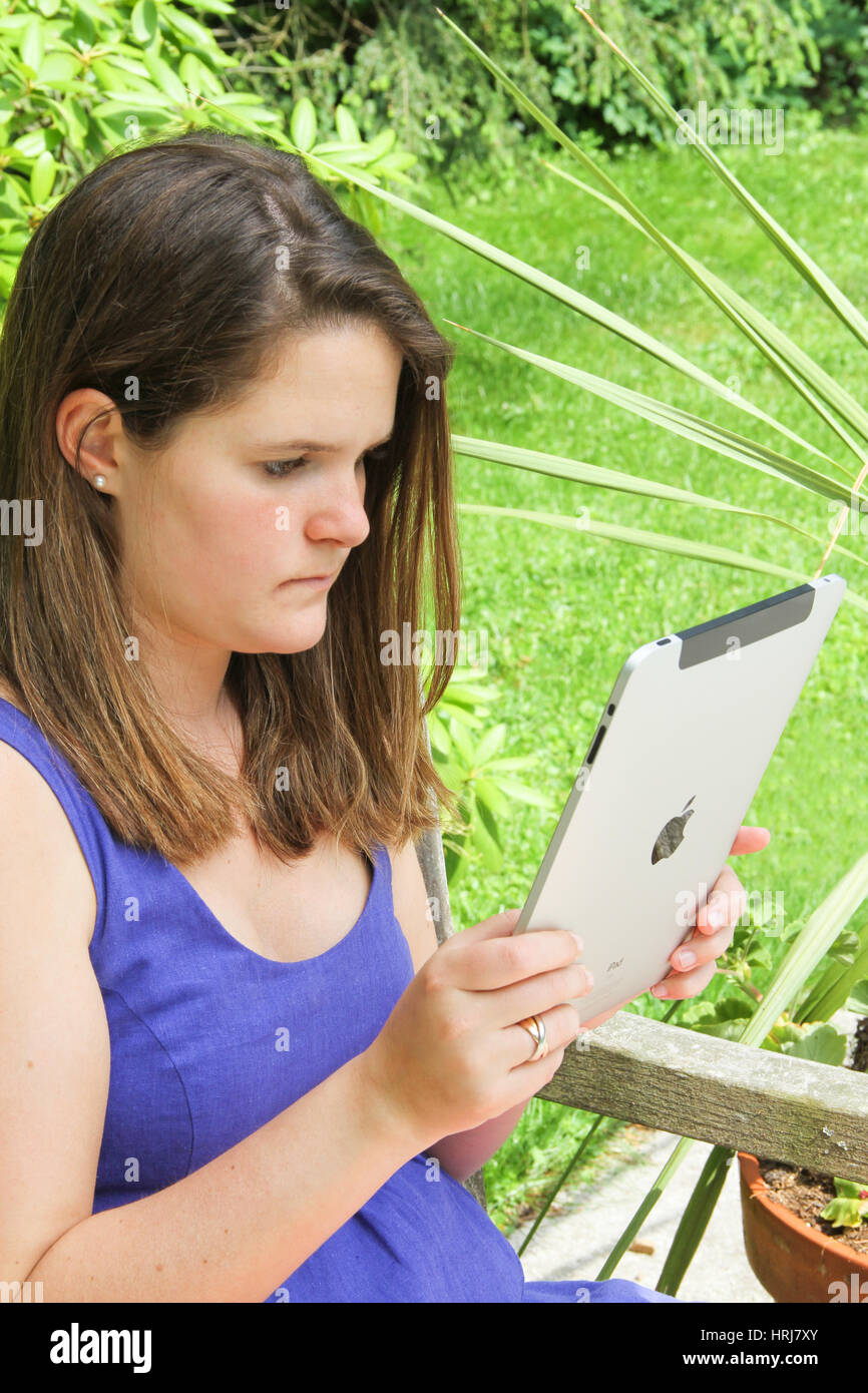 Woman using her iPad Stock Photo - Alamy