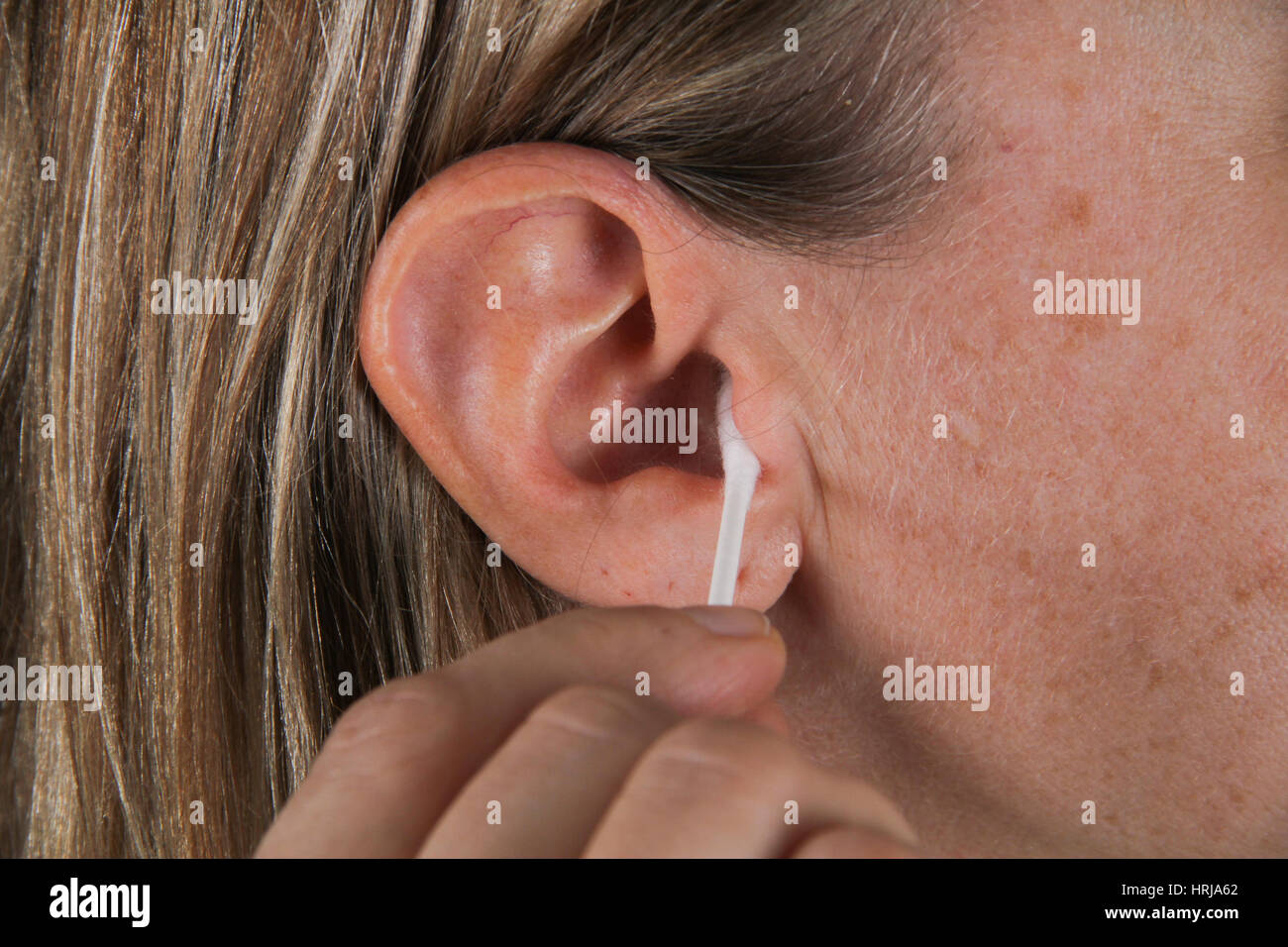 Woman Cleaning Ear Stock Photo - Alamy