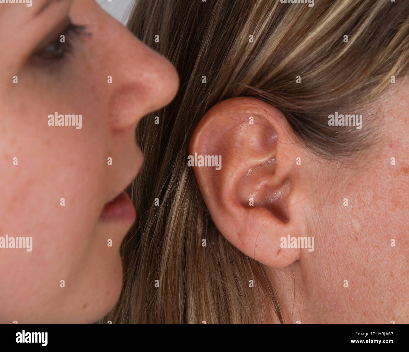 Woman Telling Secrets Stock Photo - Alamy
