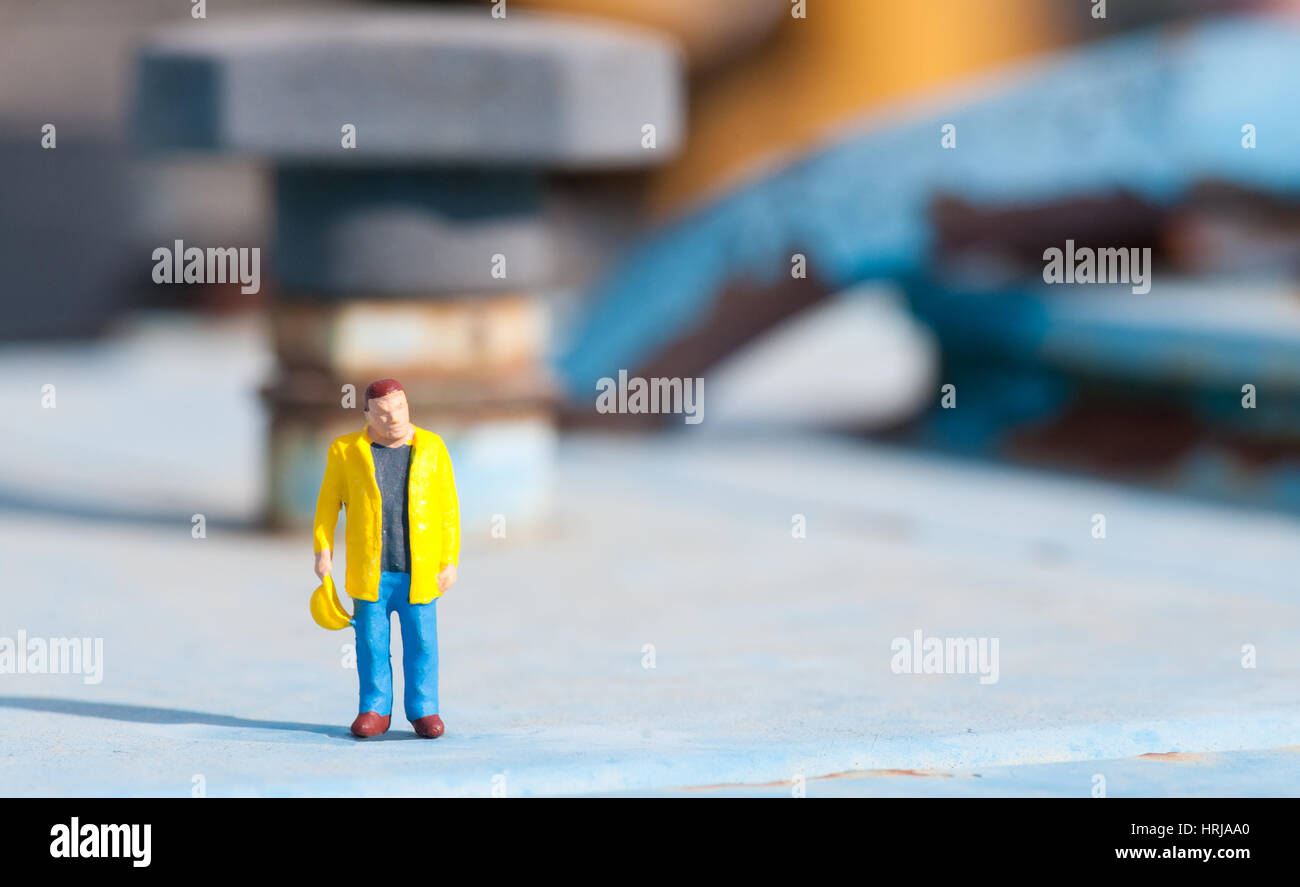 Figurine of construction worker at construction site Stock Photo - Alamy