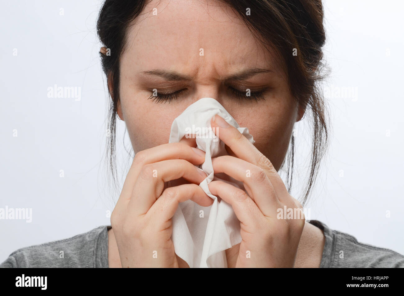 Woman Blowing Nose Stock Photo - Alamy