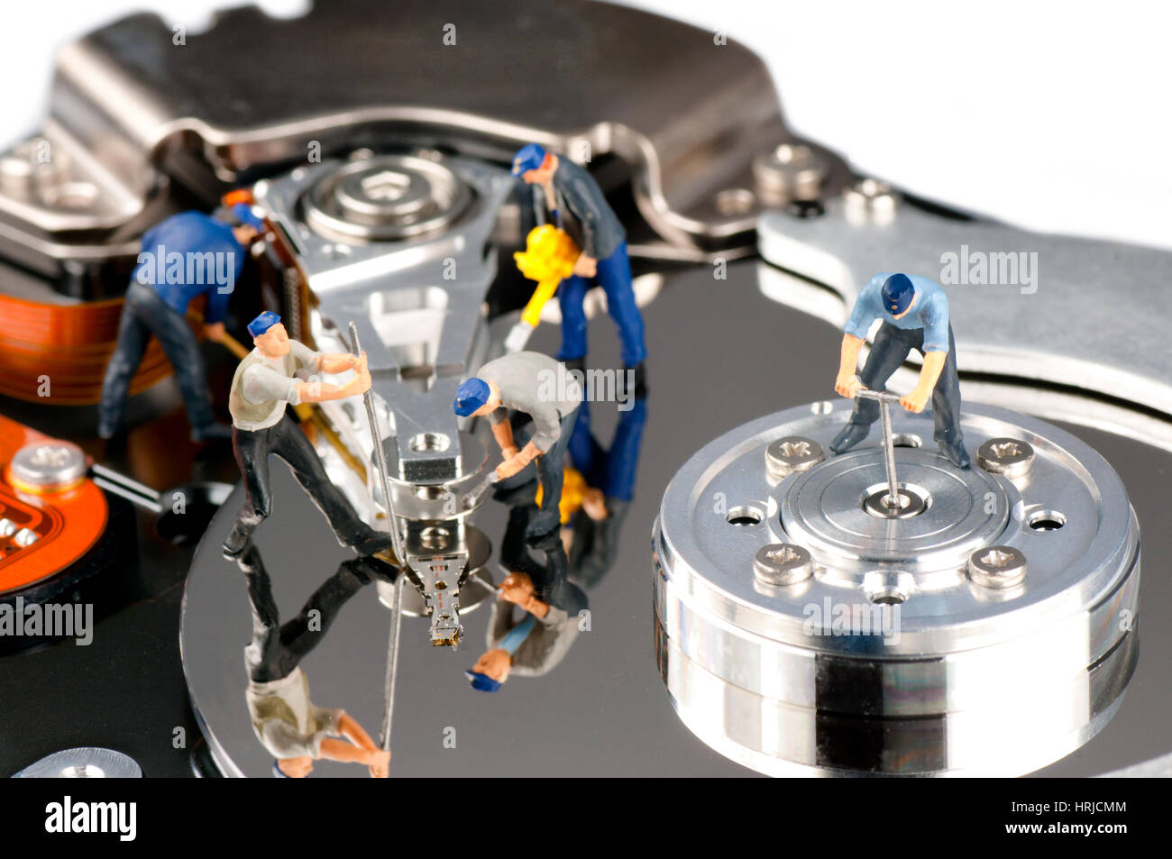 Group of construction workers repairing hard disk drive Stock Photo - Alamy