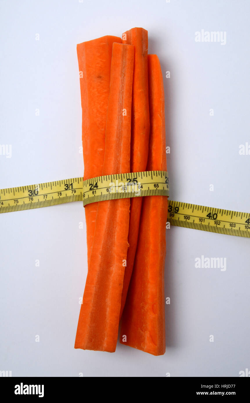 Carrots with Measuring Tape Stock Photo - Alamy