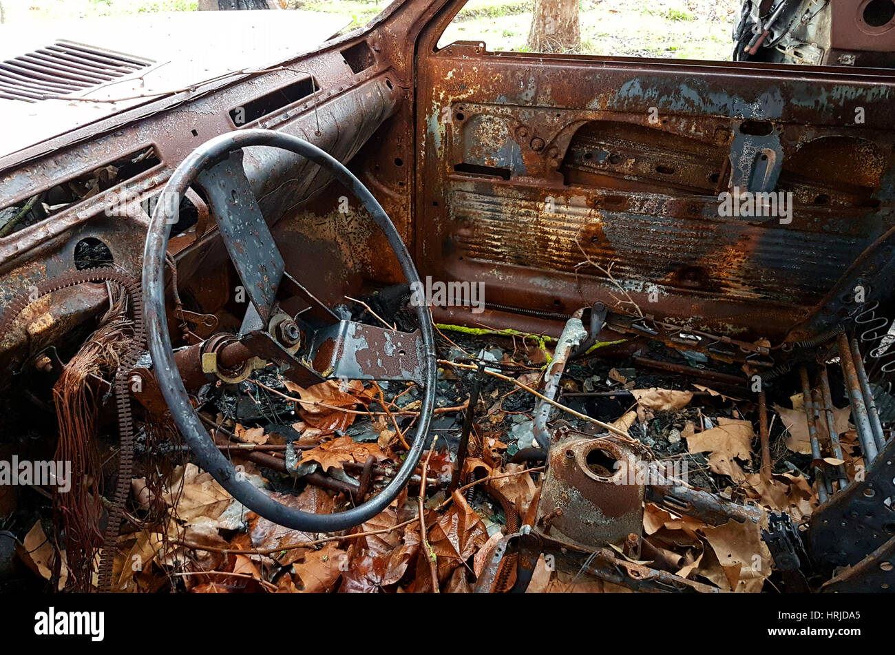 Deadly road accident with fire and rusty car abandoned along the way ...