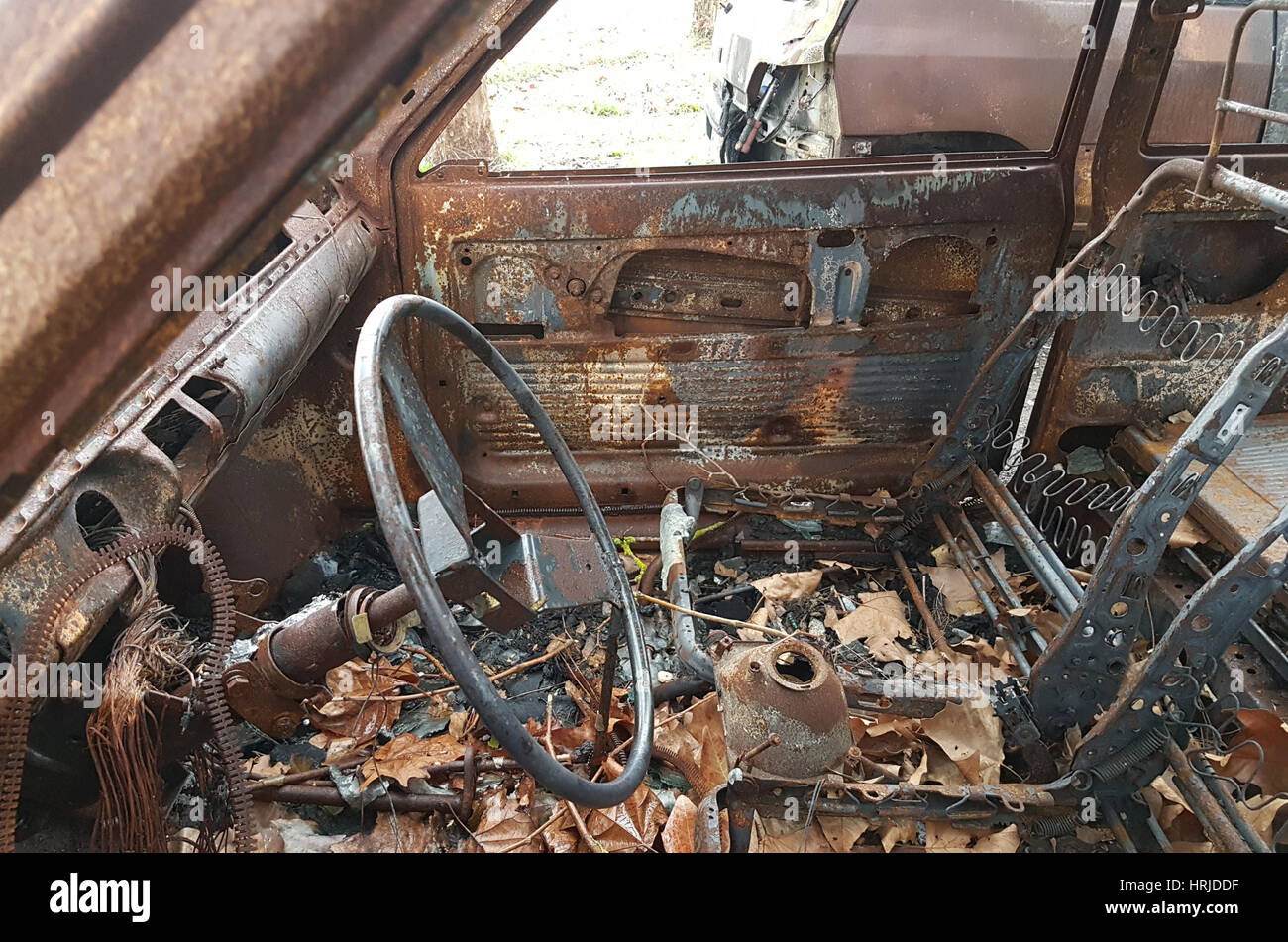 Deadly road accident with fire and rusty car abandoned along the way ...