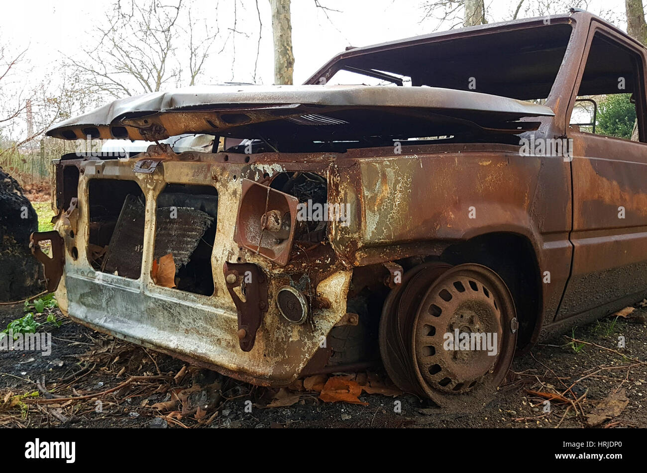 Deadly road accident with fire and rusty car abandoned along the way ...