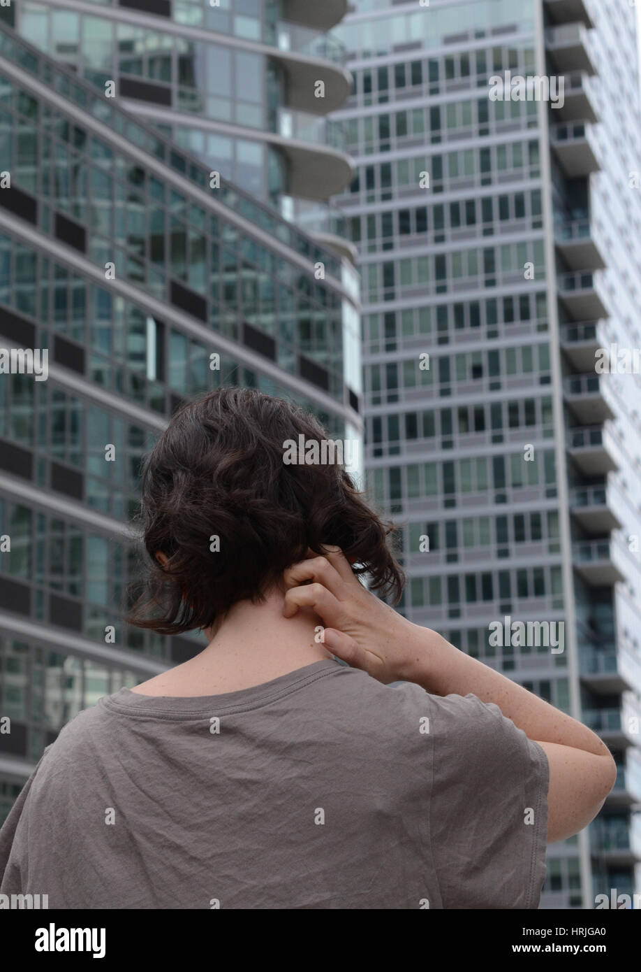 Woman Scratching Neck Stock Photo - Alamy