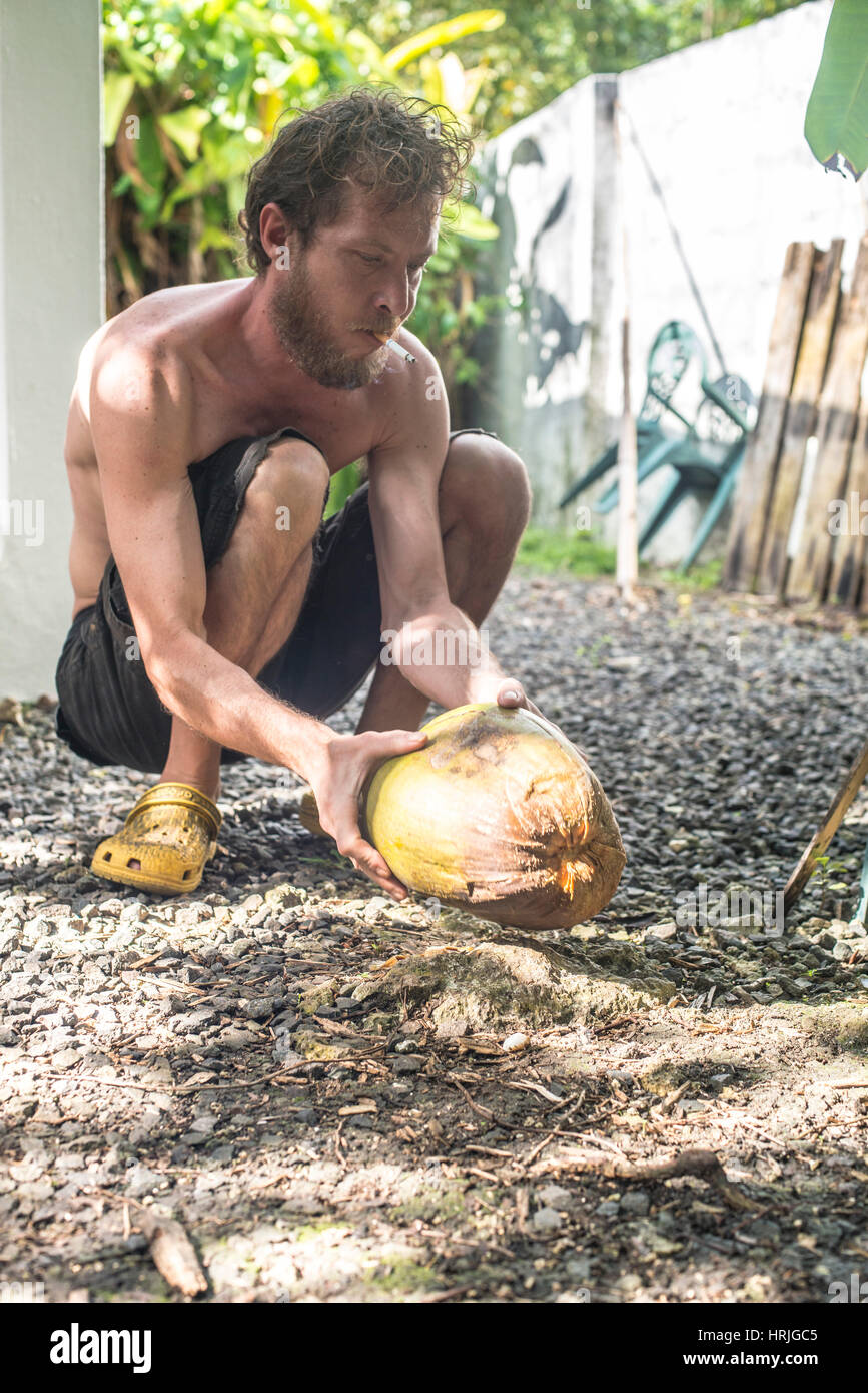 opening a coconut Stock Photo - Alamy