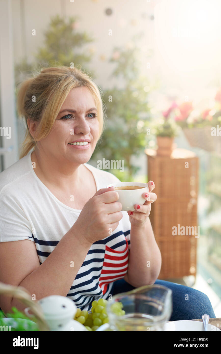 Sip of coffee on the balcony Stock Photo - Alamy