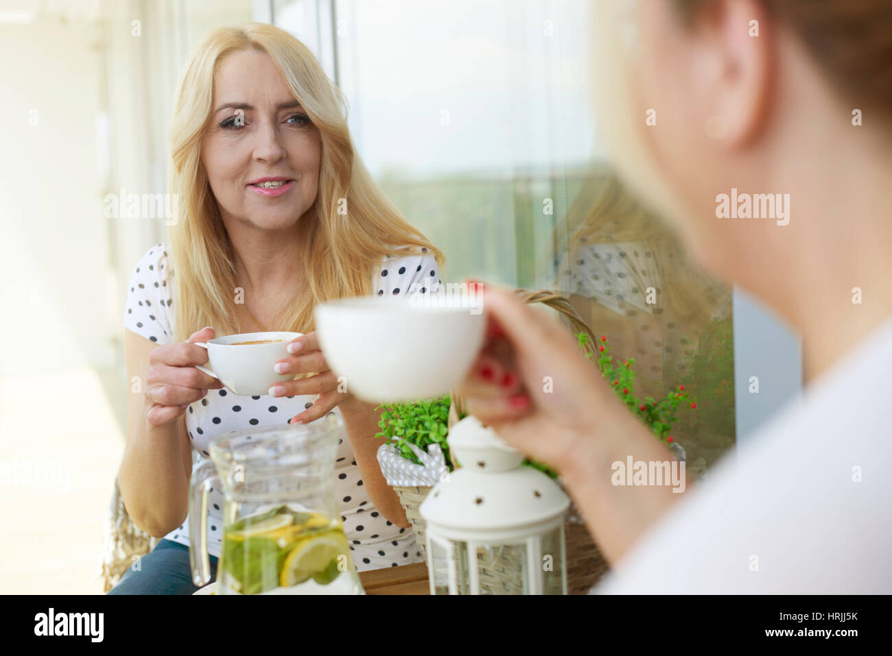 Talking over the morning coffee Stock Photo - Alamy