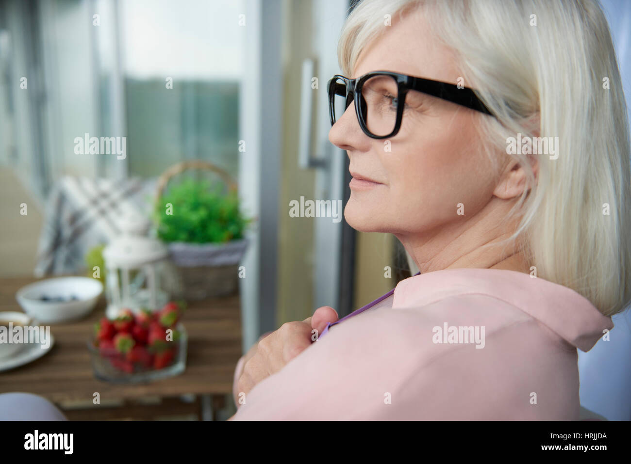 Modern grandmother at the patio Stock Photo - Alamy