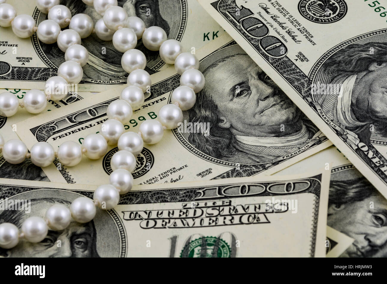 Wealth concept, US dollar banknotes and real pearls Stock Photo - Alamy