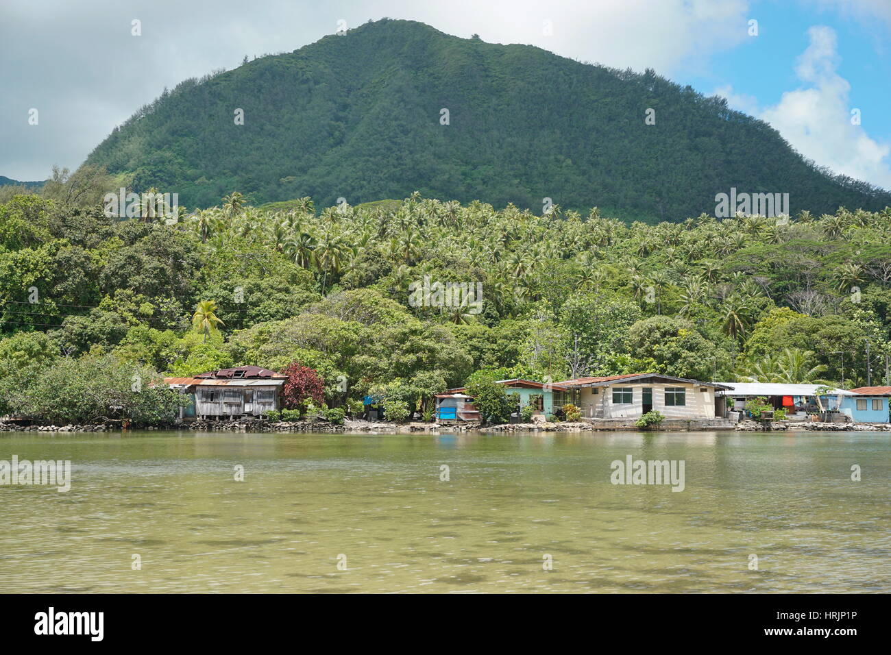 Huahine island, French Polynesia, rustic houses on the shore of the ...