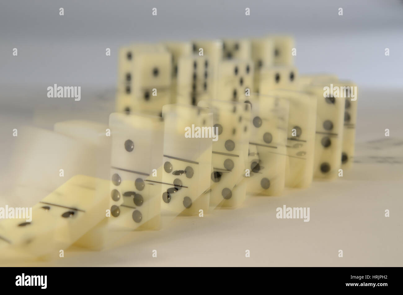 Dominoes falling with motion blur hi-res stock photography and images ...