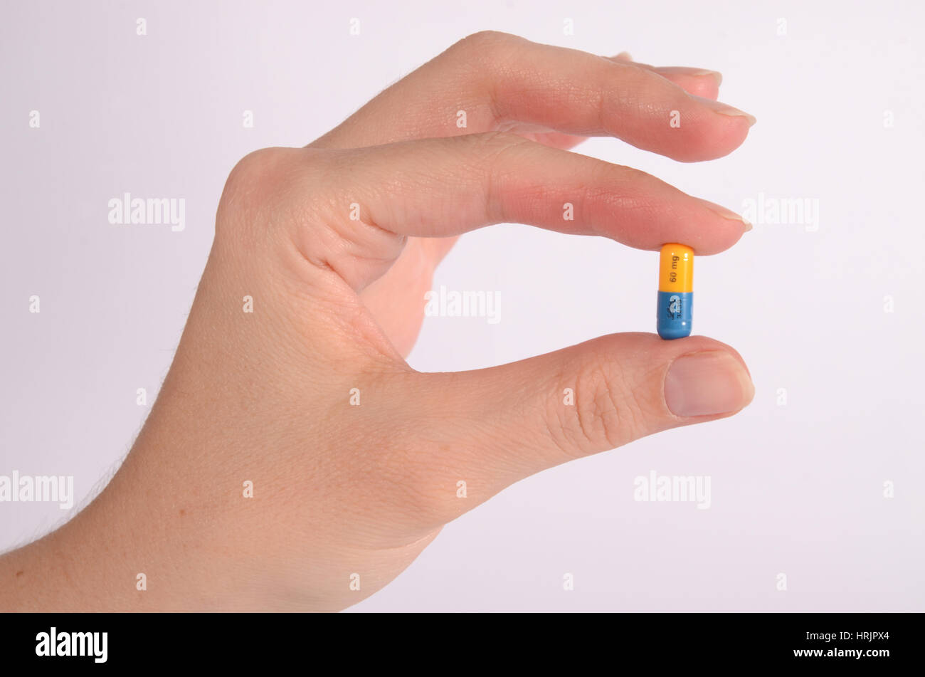 Strattera 60mg Pill in Hand Stock Photo - Alamy