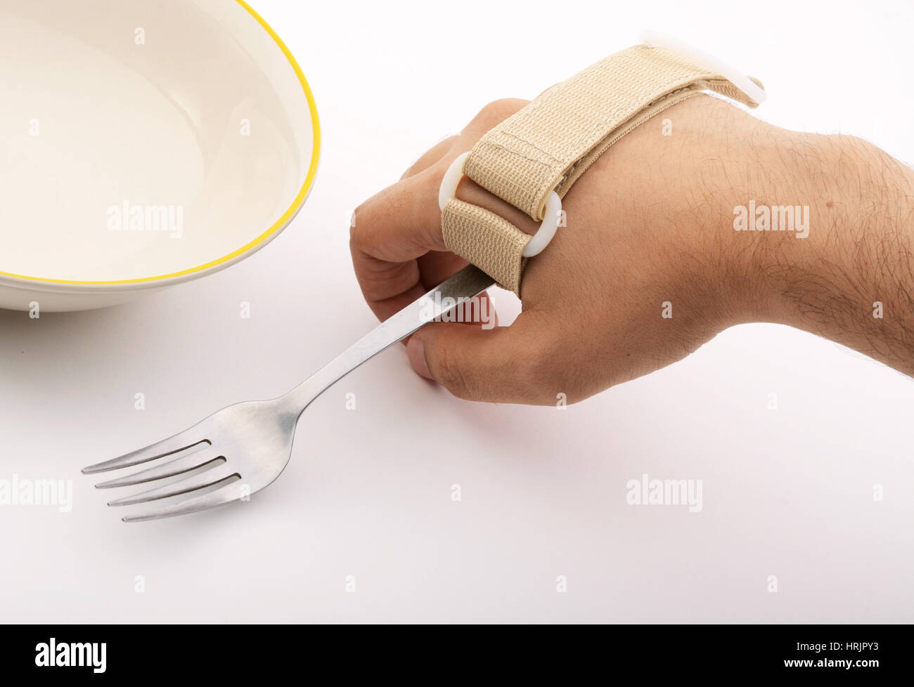 Hand Holding Eating Assist Device, Fork Stock Photo - Alamy