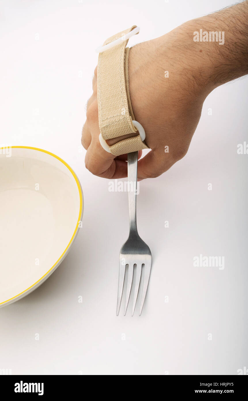 Hand Holding Eating Assist Device, Fork Stock Photo - Alamy