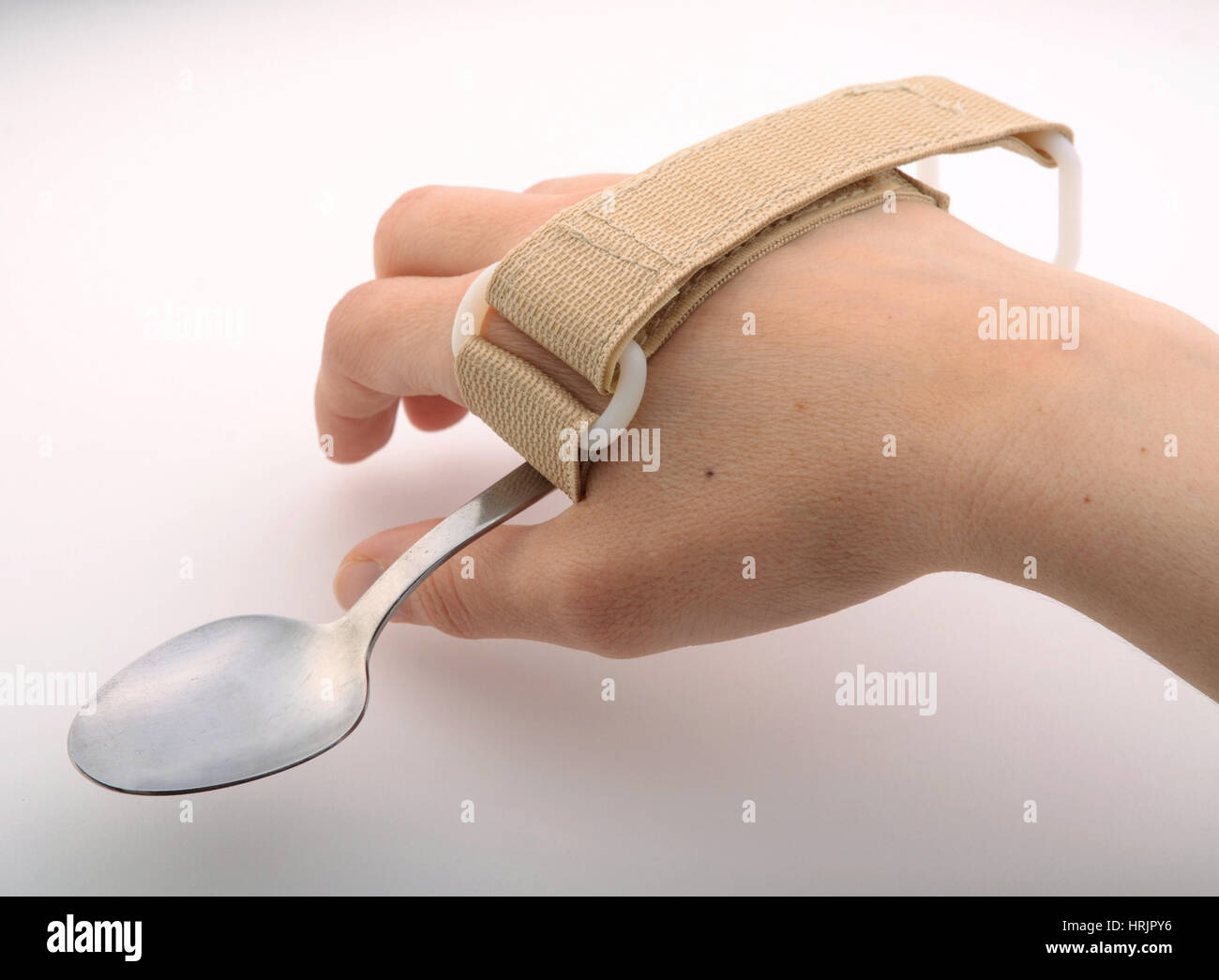Hand Holding Eating Assist Device, Spoon Stock Photo - Alamy