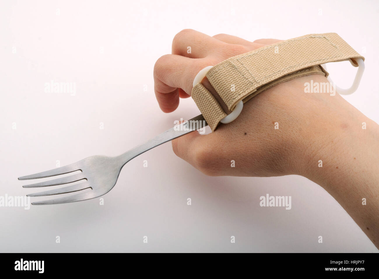 Hand holding eating assist device hi-res stock photography and images ...