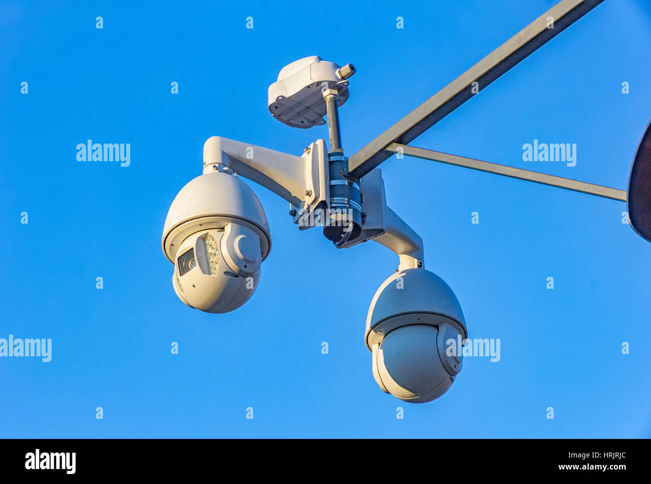 Security cctv cameras on pylon in blue background Stock Photo - Alamy