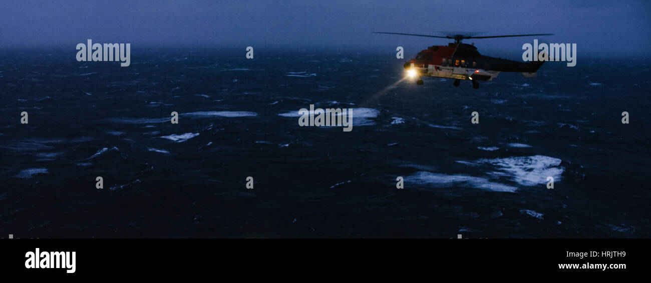 Helicopter flying over the North Sea at night Stock Photo - Alamy