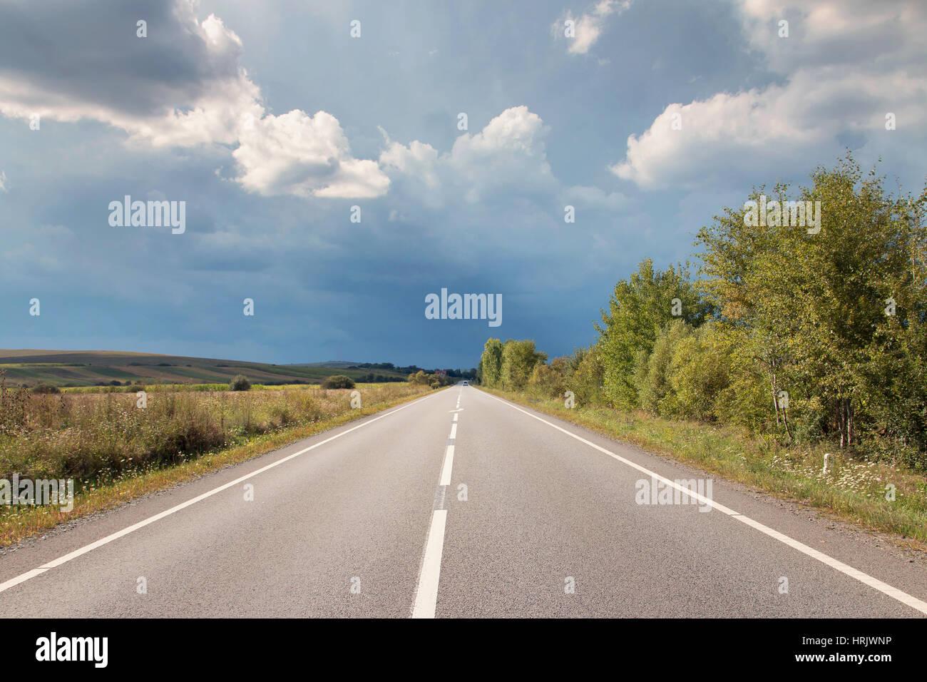 Empty country road Stock Photo - Alamy