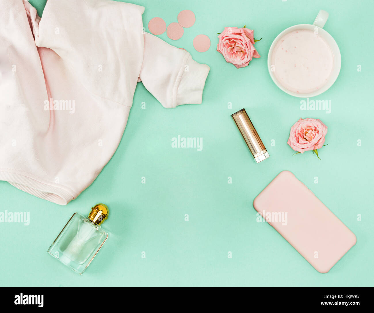 The female personal items on desktop on blue Stock Photo - Alamy