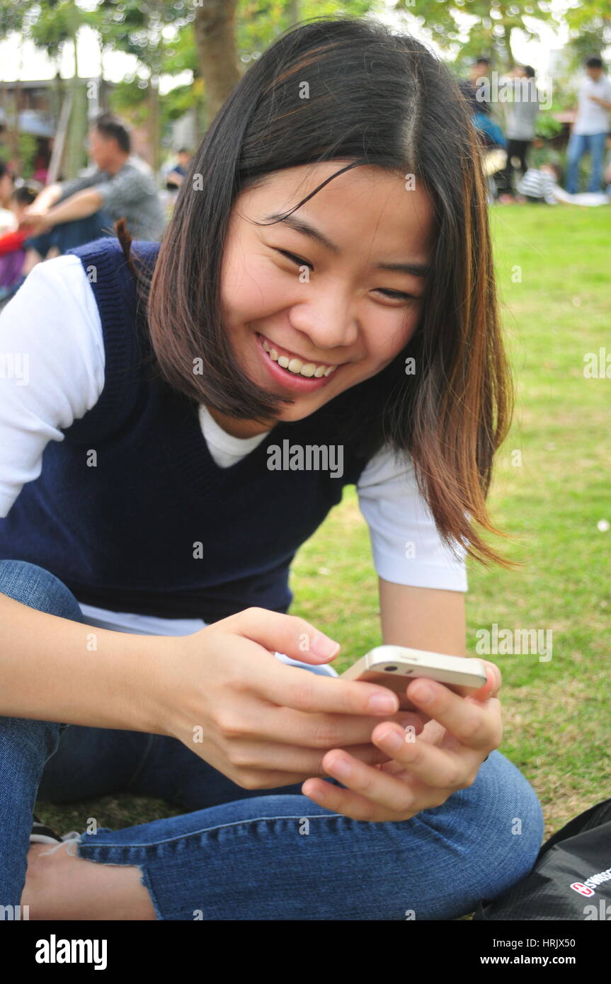 Asia Technology Chinese Woman Using a Smartphone Smiling Stock Photo ...