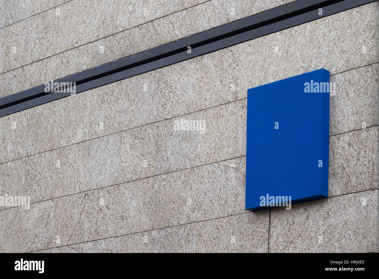 Horizontal side view of empty square blue signage on business building ...