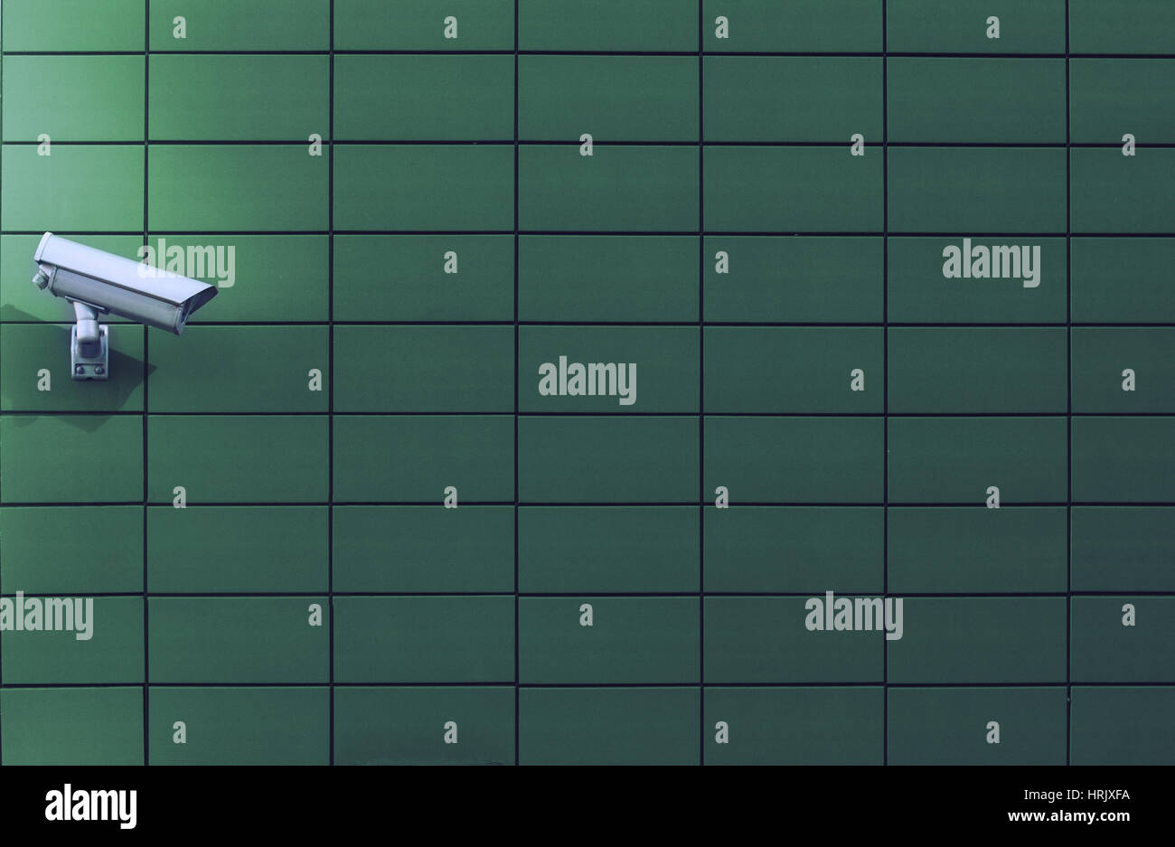 Horizontal front view of a surveillance monitoring white camera viewed ...