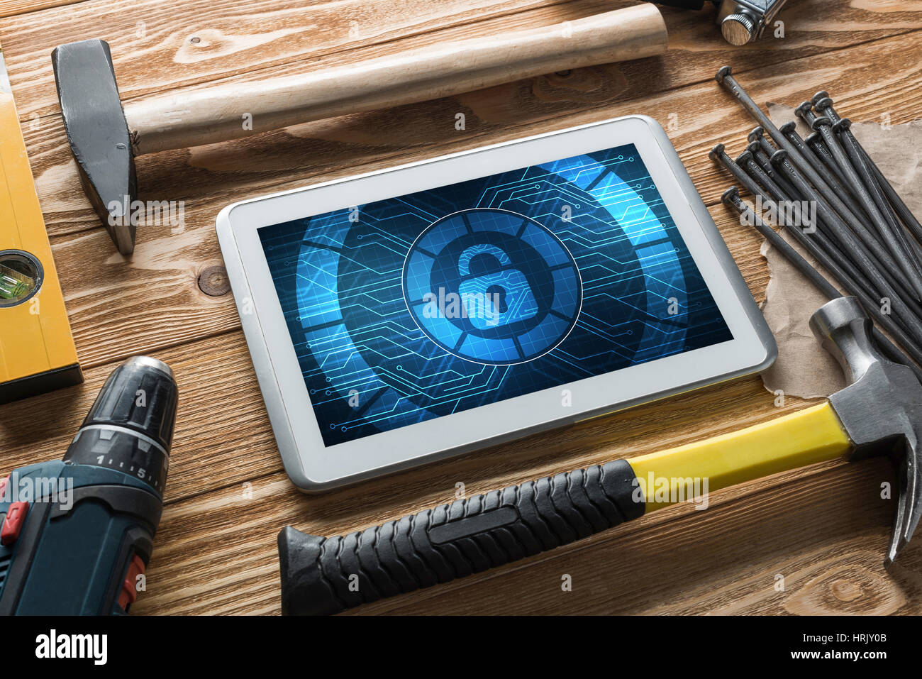 Web security and technology concept with tablet pc on wooden table ...