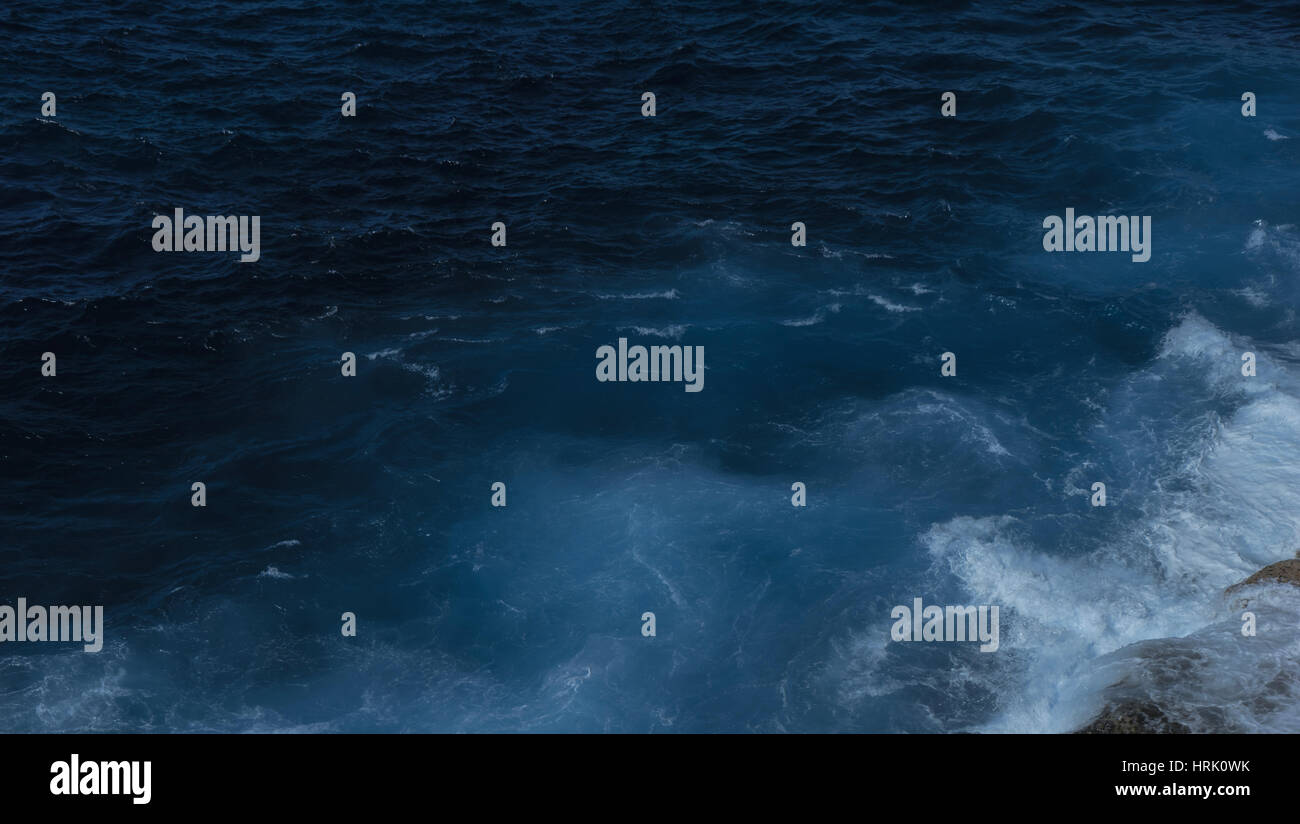 Deep ocean waves splashing on the cliff side Stock Photo - Alamy