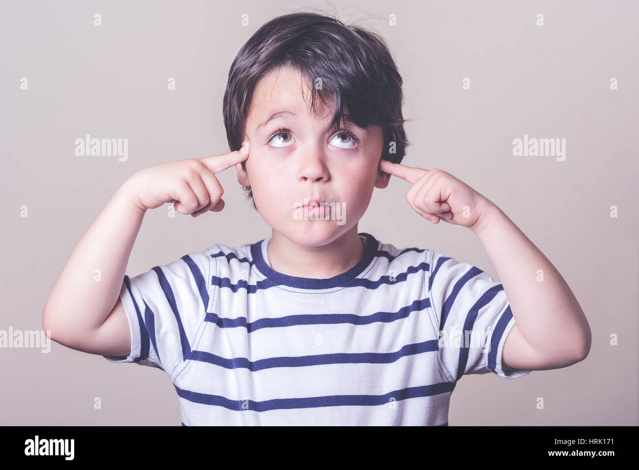 Funny thoughtful child Stock Photo - Alamy