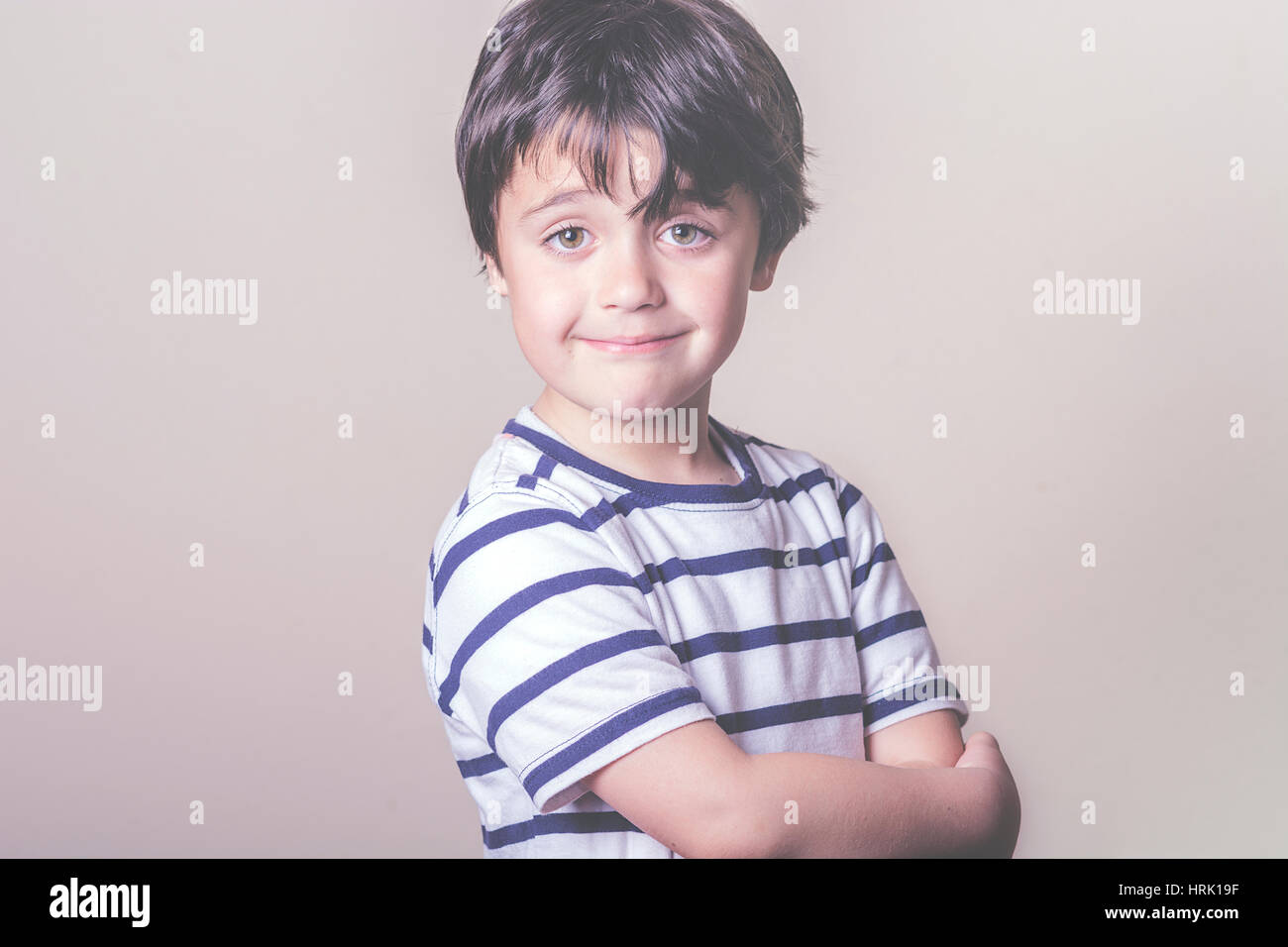 Happy child looks at camera Stock Photo - Alamy