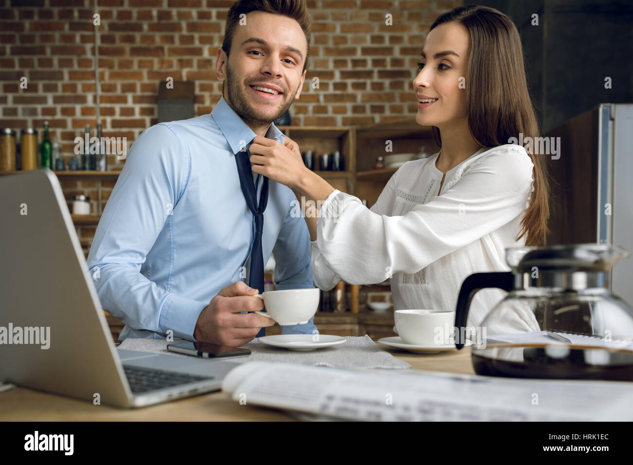 Handsome husband helping happy hi-res stock photography and images - Alamy