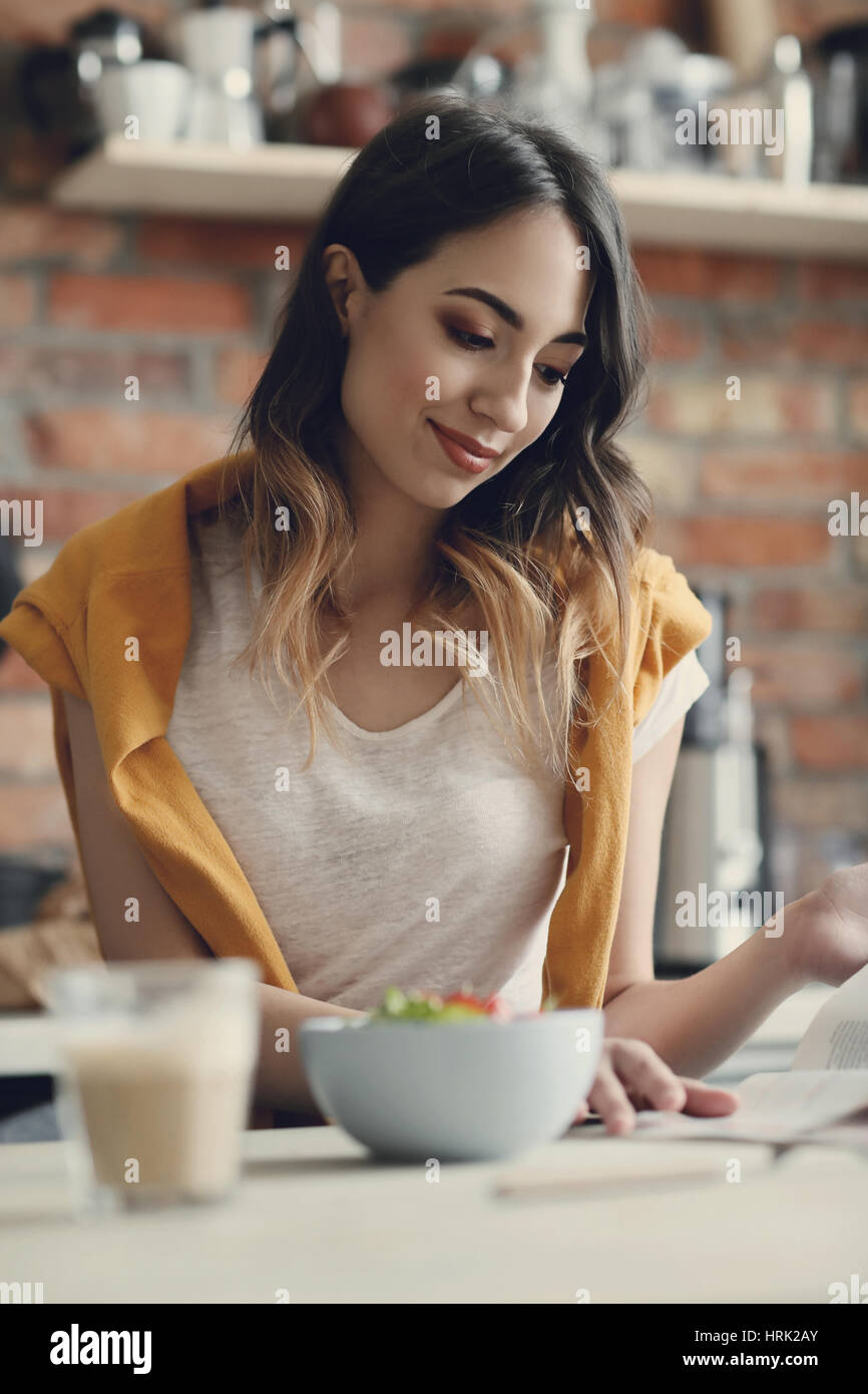 Lovely girl in the kitchen Stock Photo - Alamy