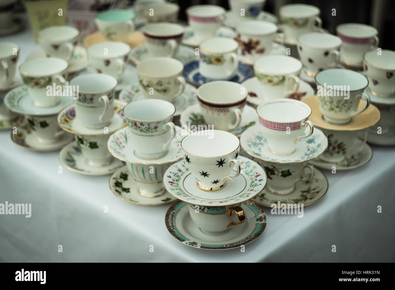 An overview of a table of tea cups at afternoon tea Stock Photo - Alamy