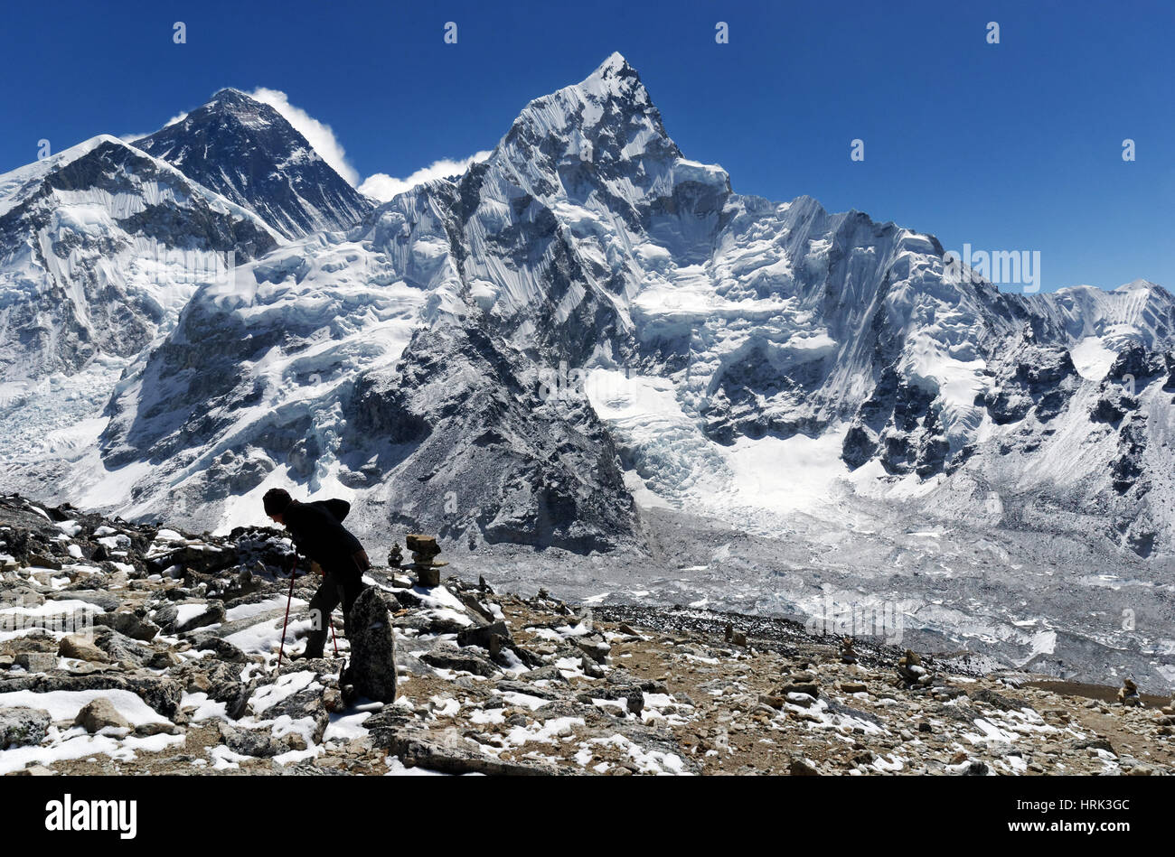 An exhausted lady trekker on the summit of Kala Pattar in the Khumbu ...