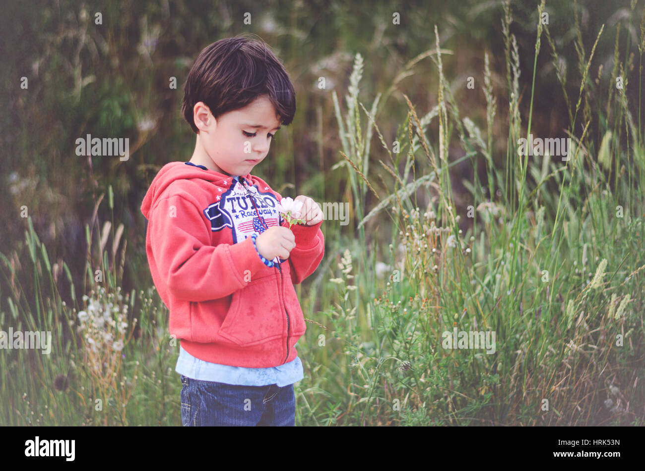 child with spring flowers. Child outdoor portrait Stock Photo - Alamy