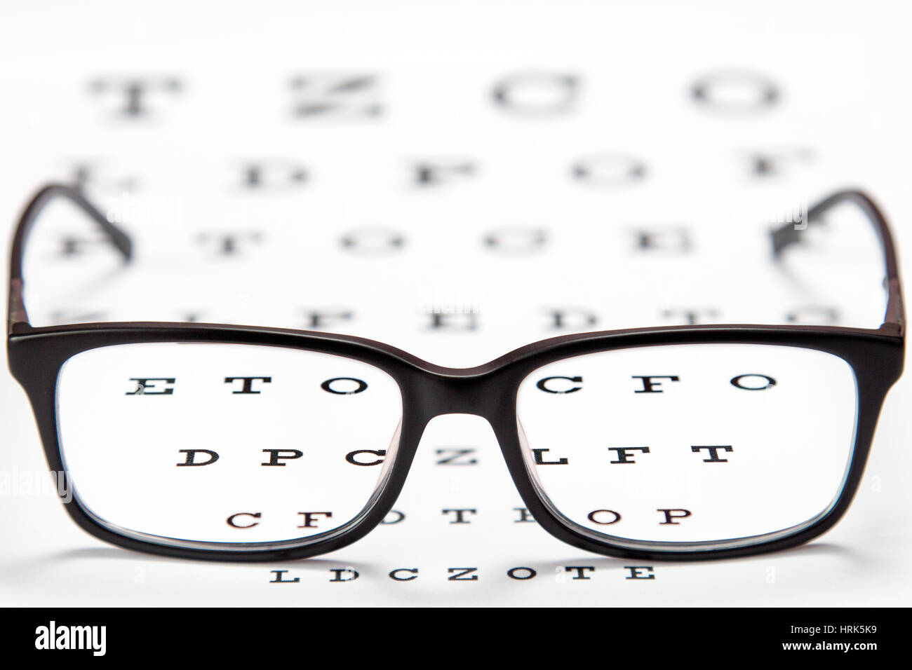 Glasses on a eye exam chart to test eyesight accuracy Stock Photo - Alamy