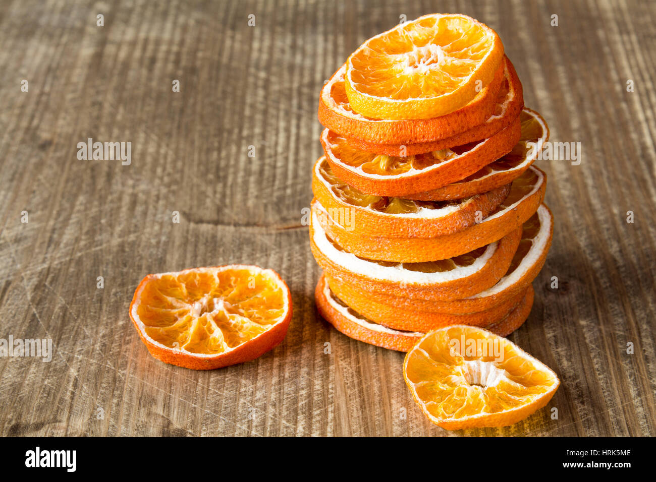 Stack from slices of orange fruit on the wooden background Stock Photo ...