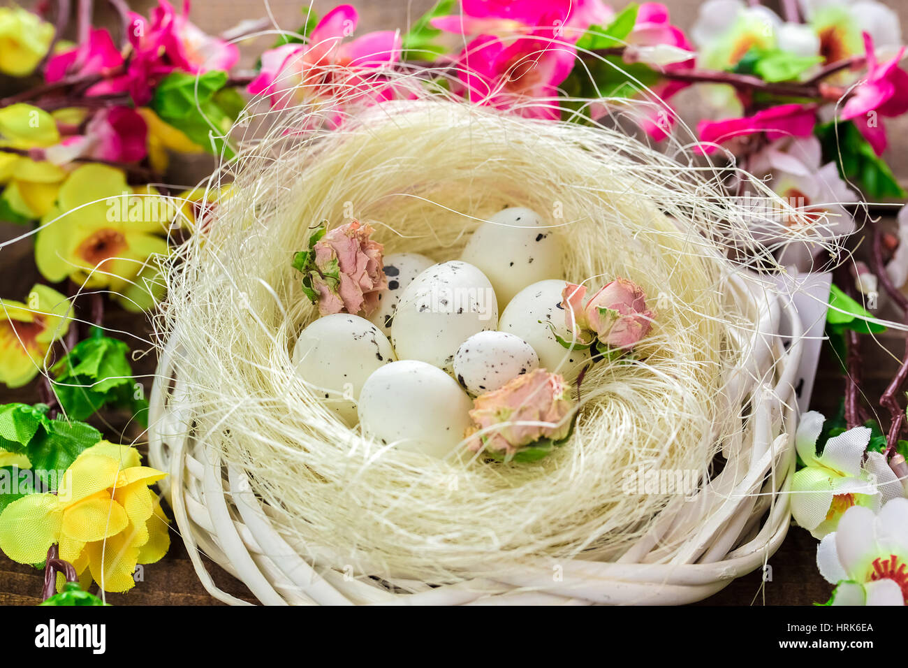 Beautiful Easter eggs with flowers on the wooden background Stock Photo ...